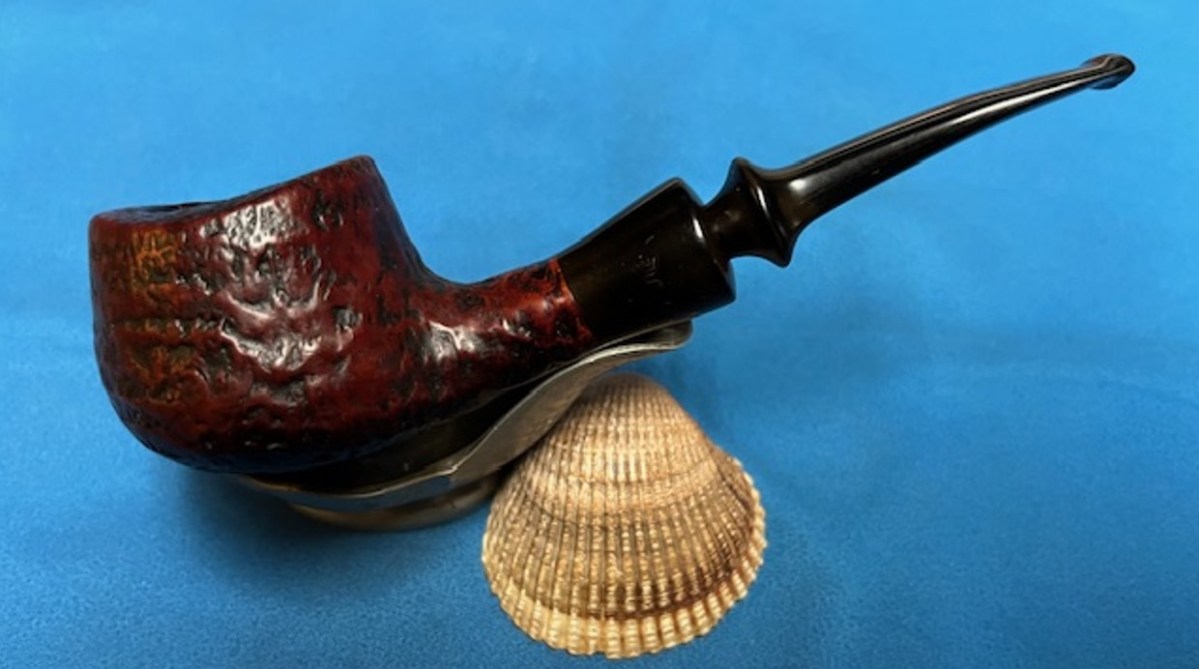 Another Filthy and Messy Stanwell Made in Denmark Pot on the table ...